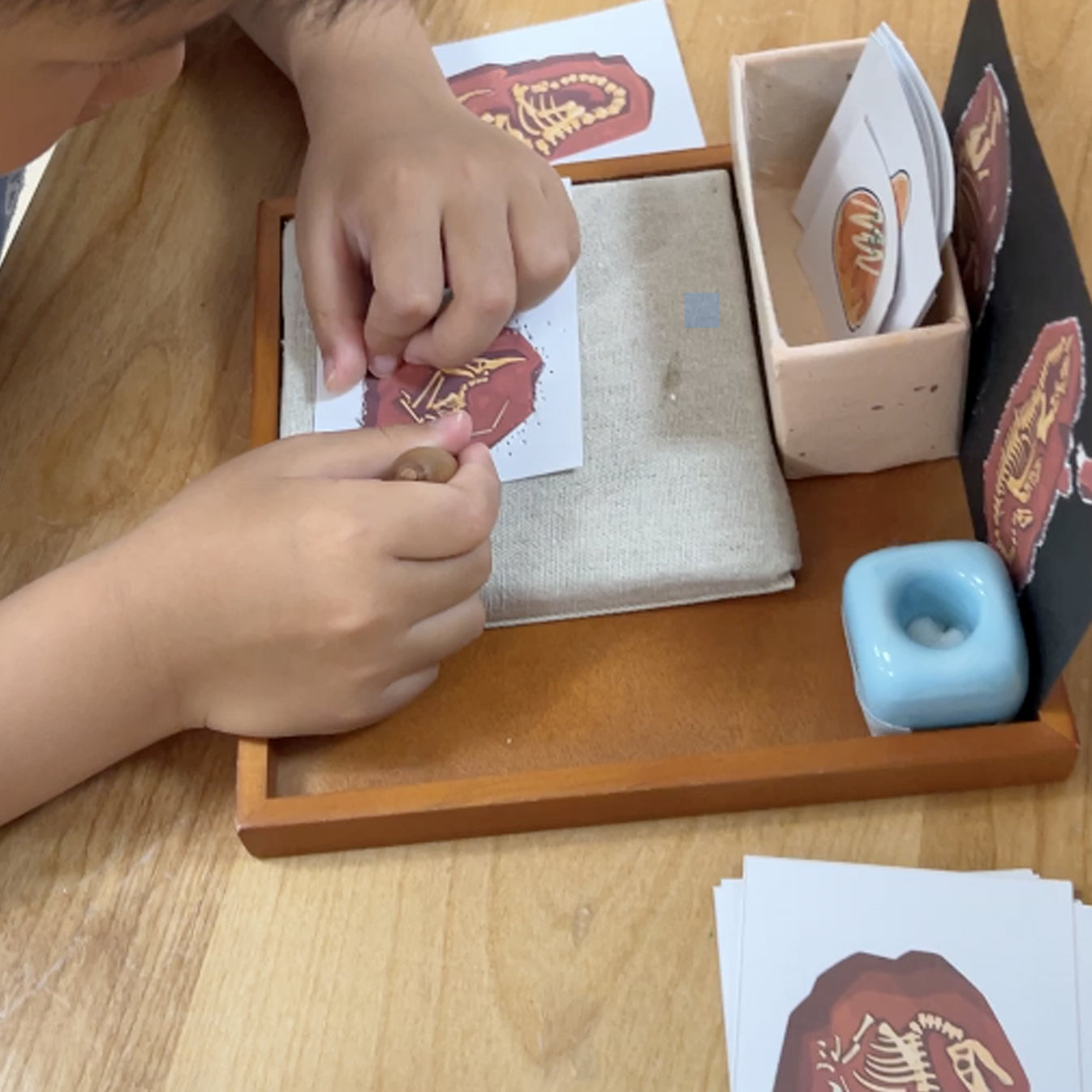 Pin Punching Work - Excavation of dinosaur fossils – Montessori ...